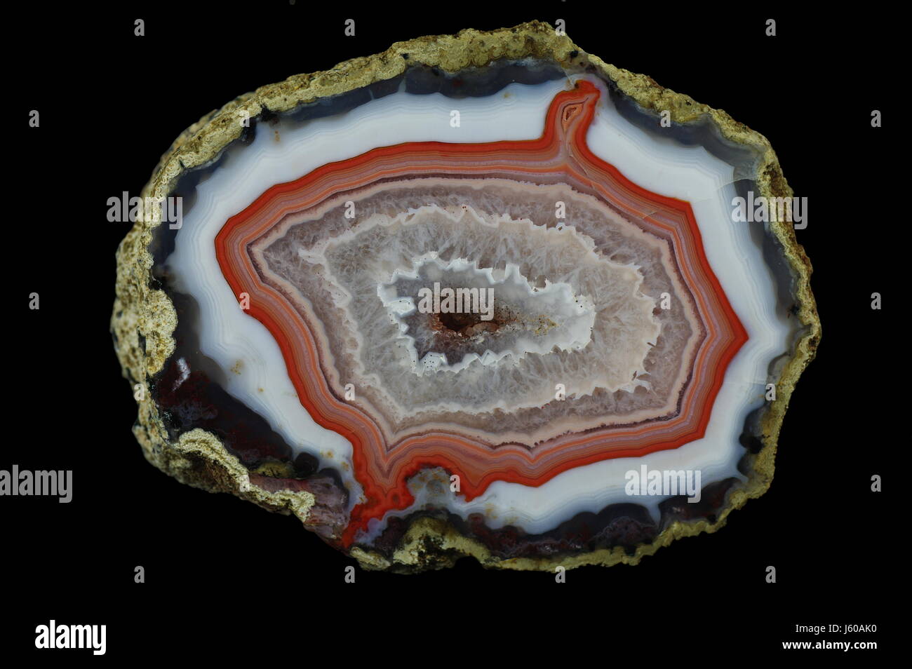A cross section of the agate stone with quartz geode. Multicolored ...