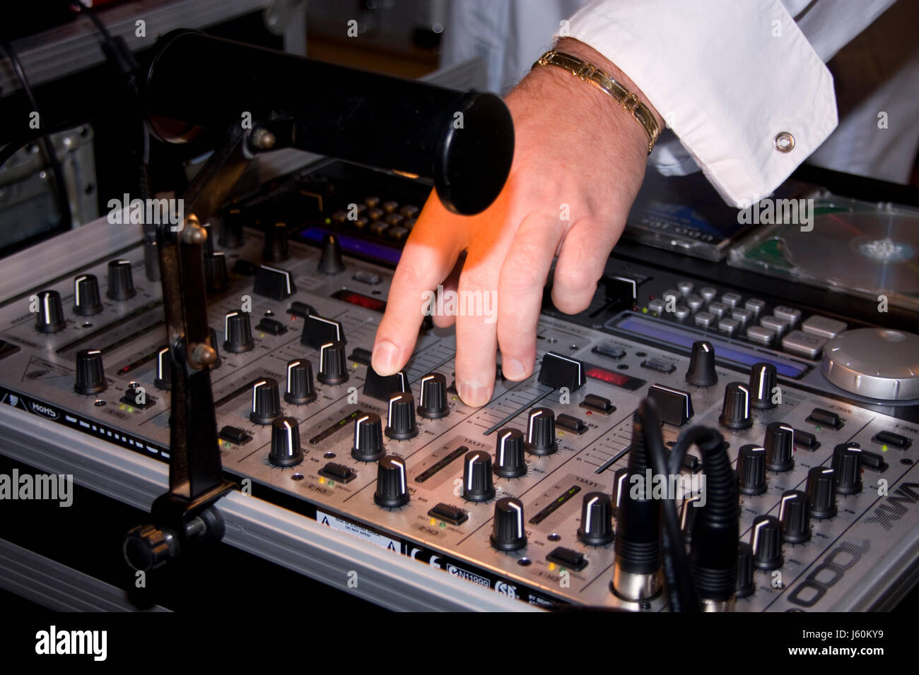 hand of a dj on the mixer Stock Photo - Alamy