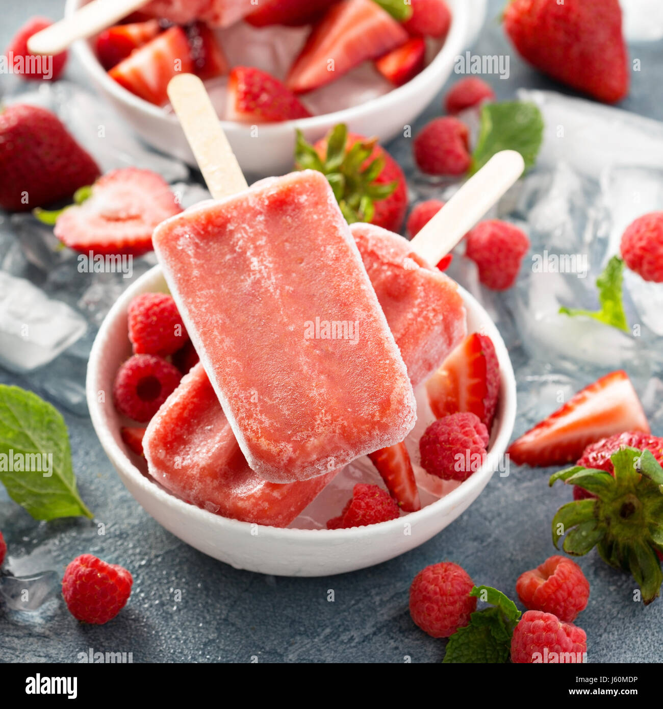 Strawberry and raspberry popsicles Stock Photo - Alamy