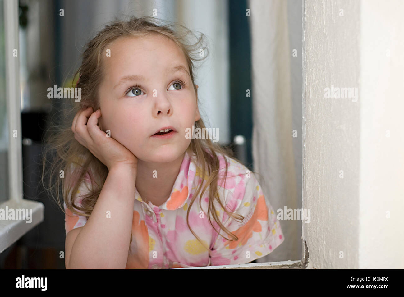 girl looking out the window Stock Photo - Alamy