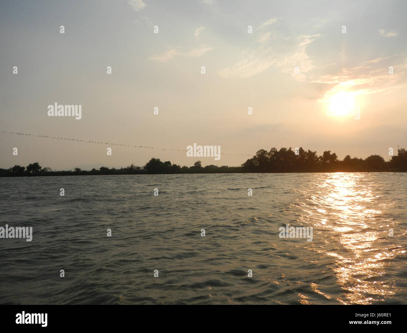 This image likely depicts the villages and riverbanks of Masantol in ...