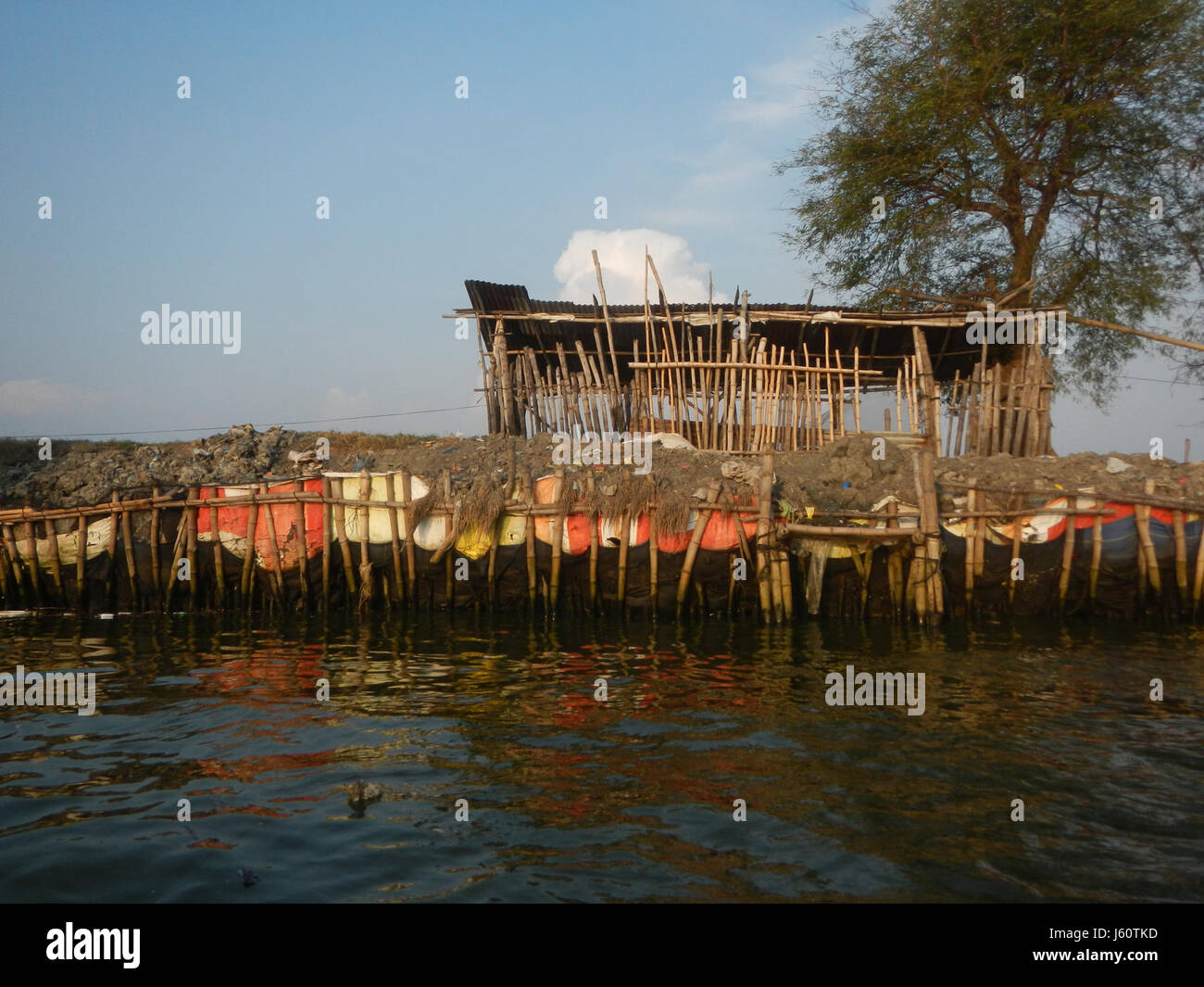 This image shows the riverbanks of Panasahan in Malolos City, Bulacan ...