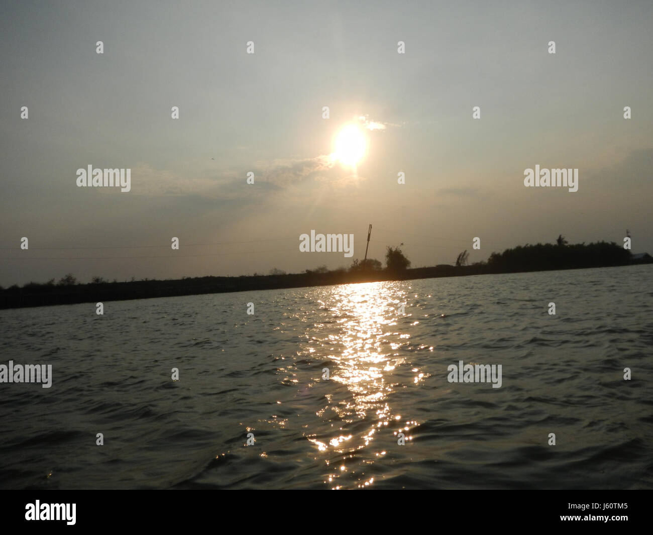 This photograph captures the river banks of Panasahan in Malolos City ...