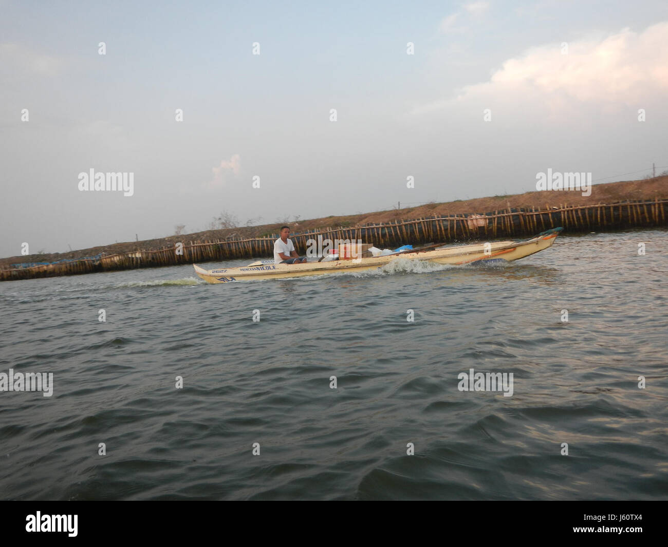 This image captures a beautiful sunset along the riverbanks of ...