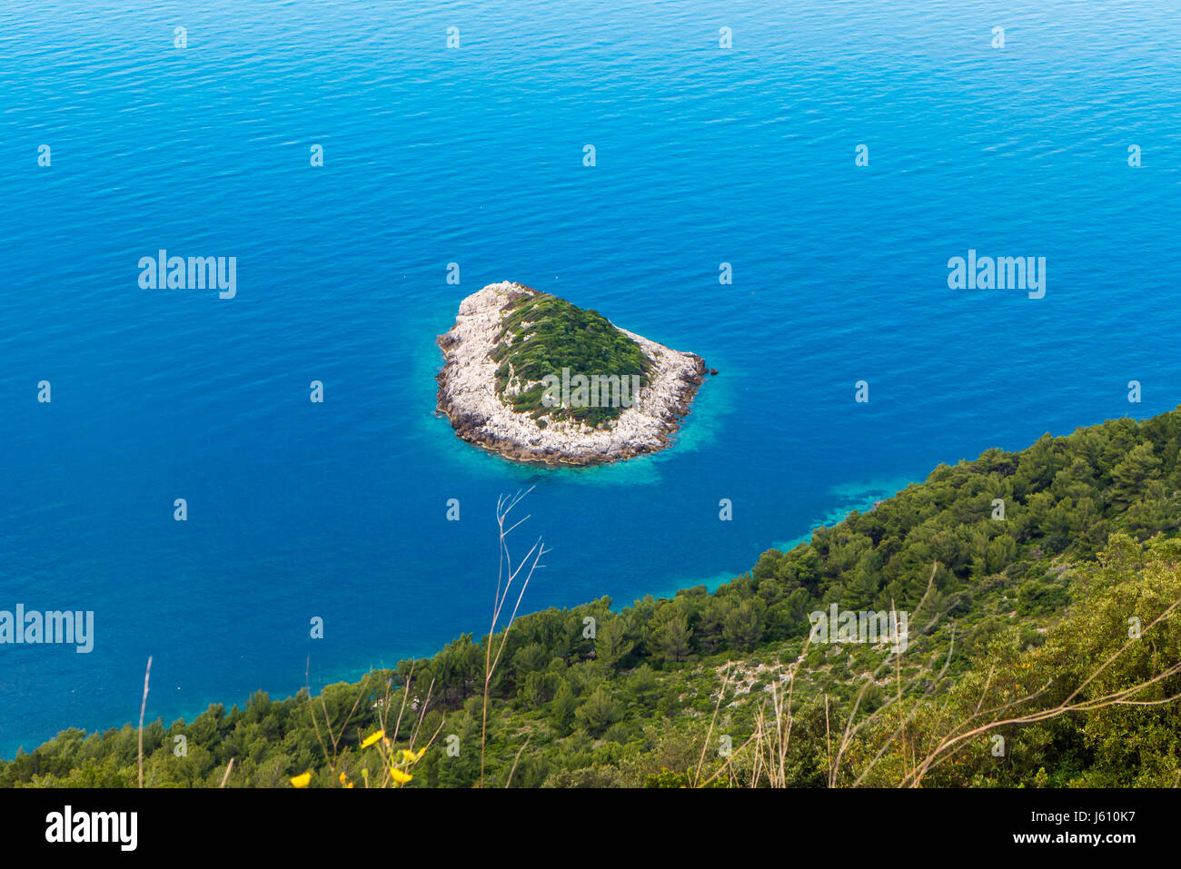 Small island in the sea, seen from above Stock Photo - Alamy
