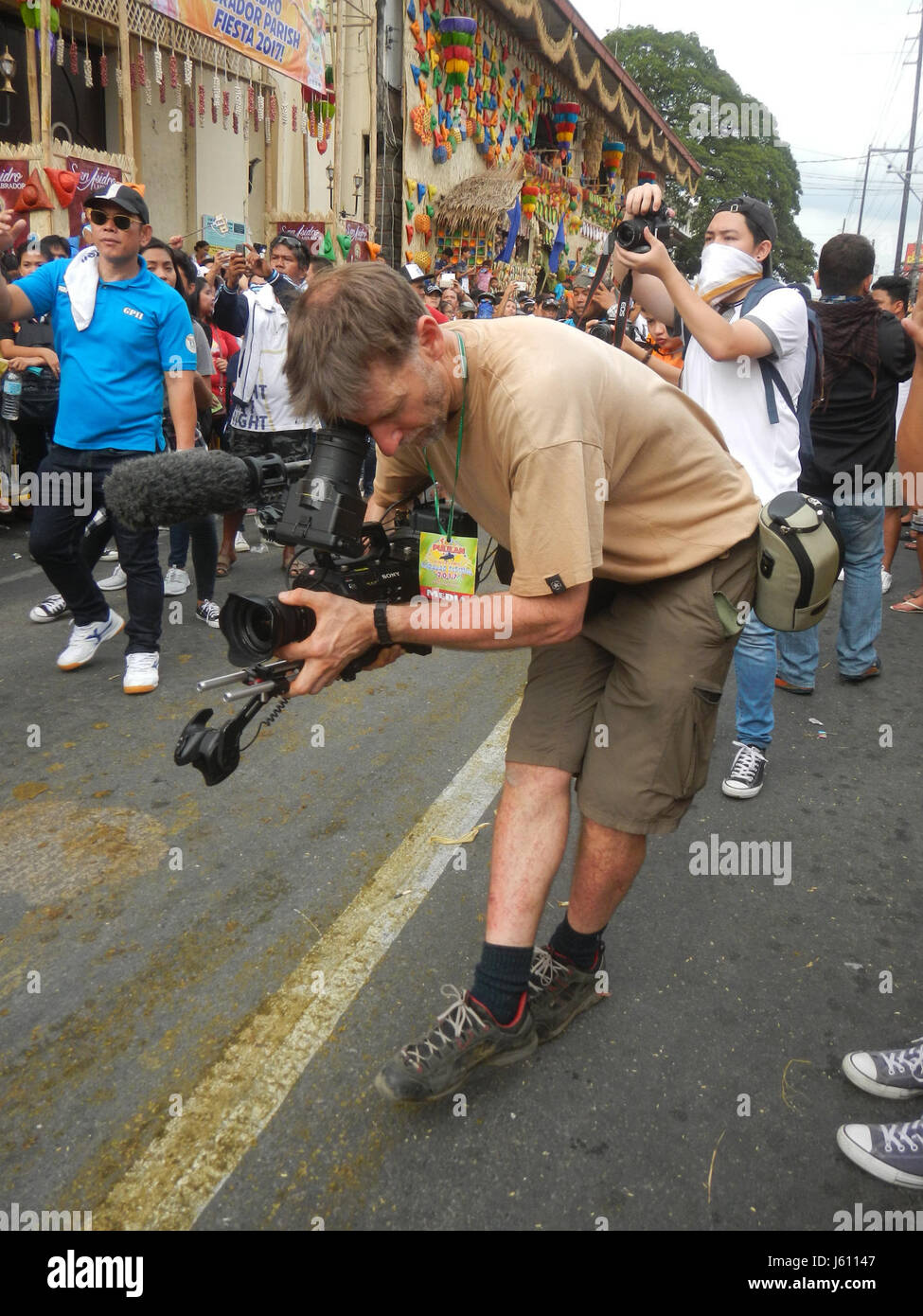 This photograph captures the Carabao Kneeling Festival, held during the ...