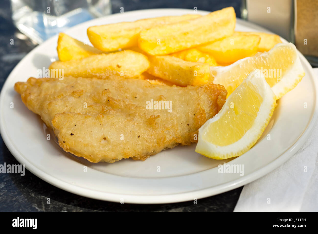 Traditional Irish fish and chips with lemon on white plate Stock Photo ...