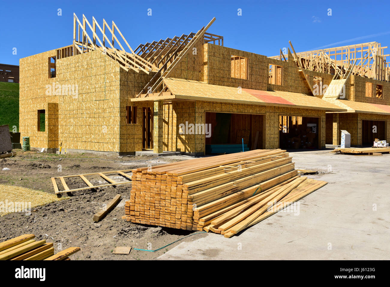 Wood frame residential buildings under construction Stock Photo - Alamy