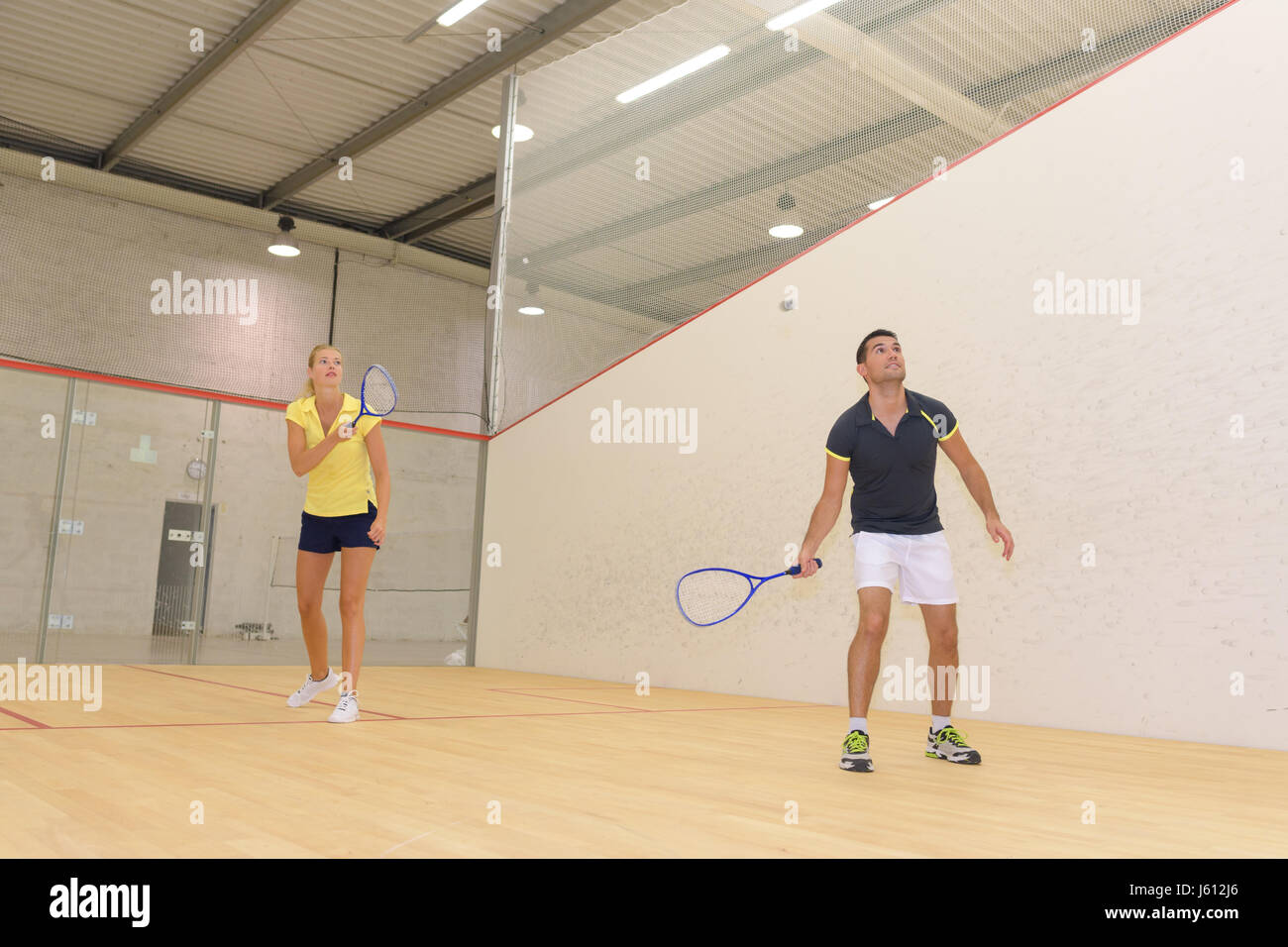 couple playing squash Stock Photo - Alamy