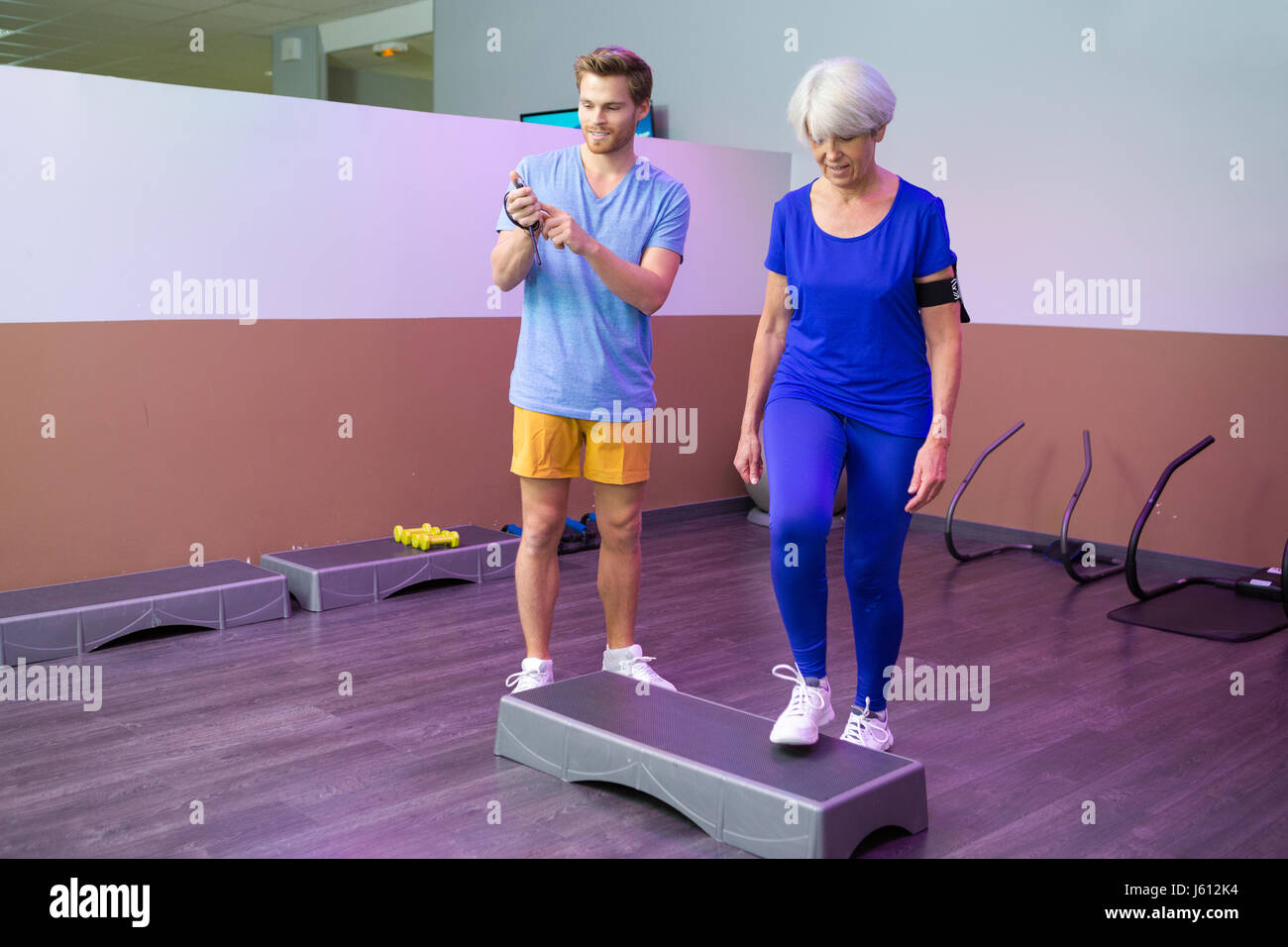 Senior woman doing routine exercises hi-res stock photography and ...