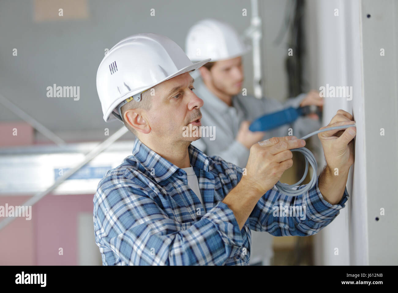 builders at work Stock Photo - Alamy