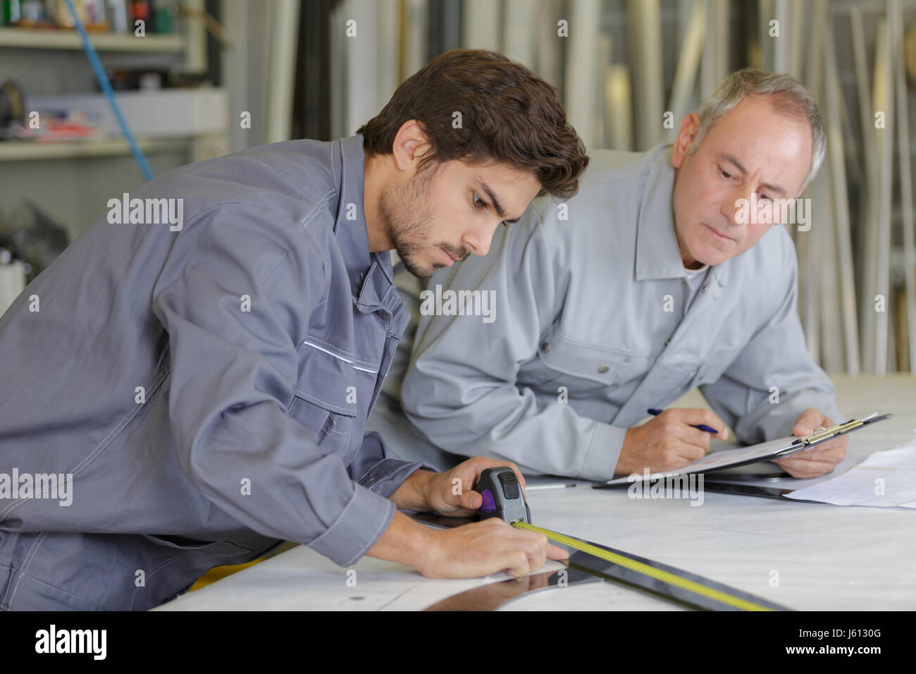 Man using tape measure hi-res stock photography and images - Alamy