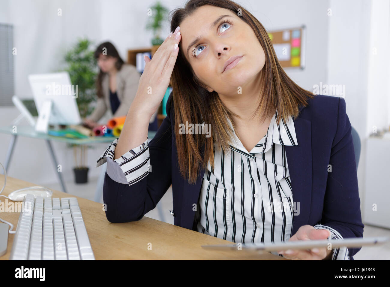 focus serious busy female office worker Stock Photo - Alamy