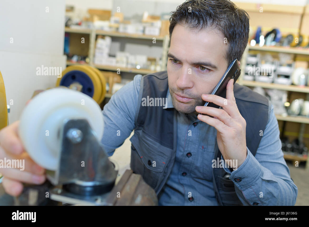 Mechanic repairing small wheels hi-res stock photography and images - Alamy