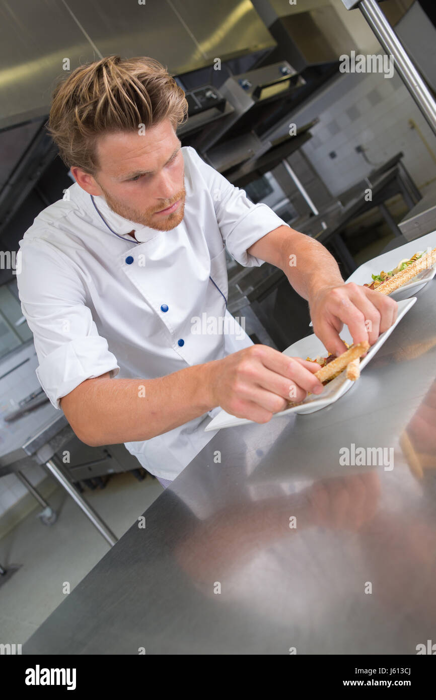 Chef plating food Stock Photo - Alamy