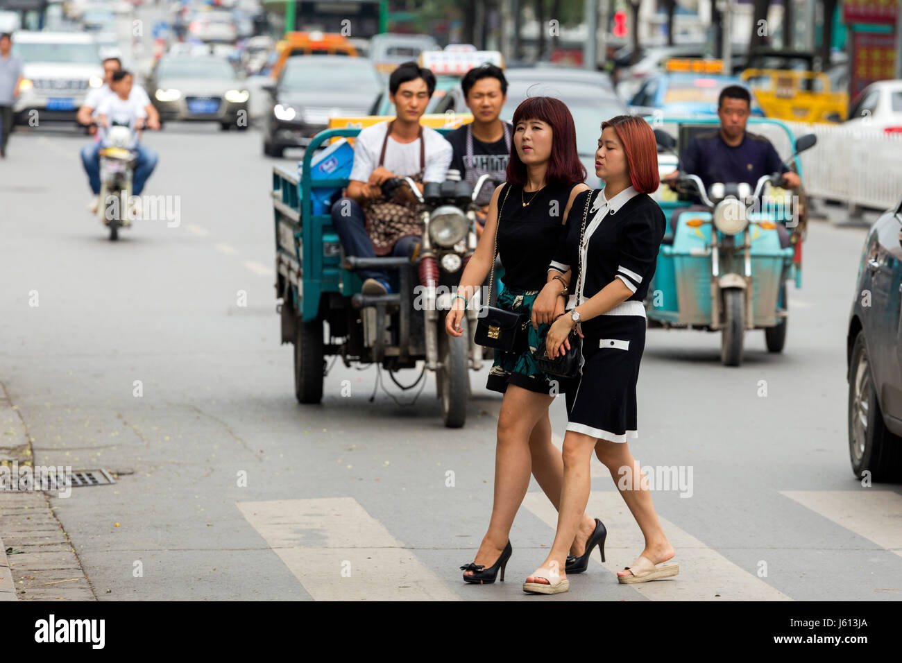Young girls crossing the street in Yinchuan, Ningxia, China Stock Photo ...