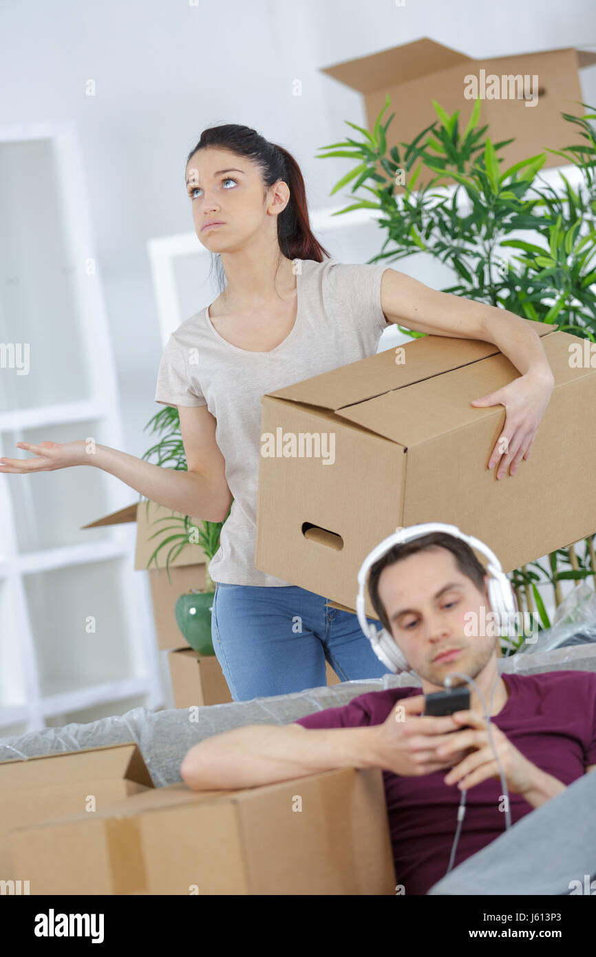 Frustrated woman with idle boyfriend Stock Photo - Alamy