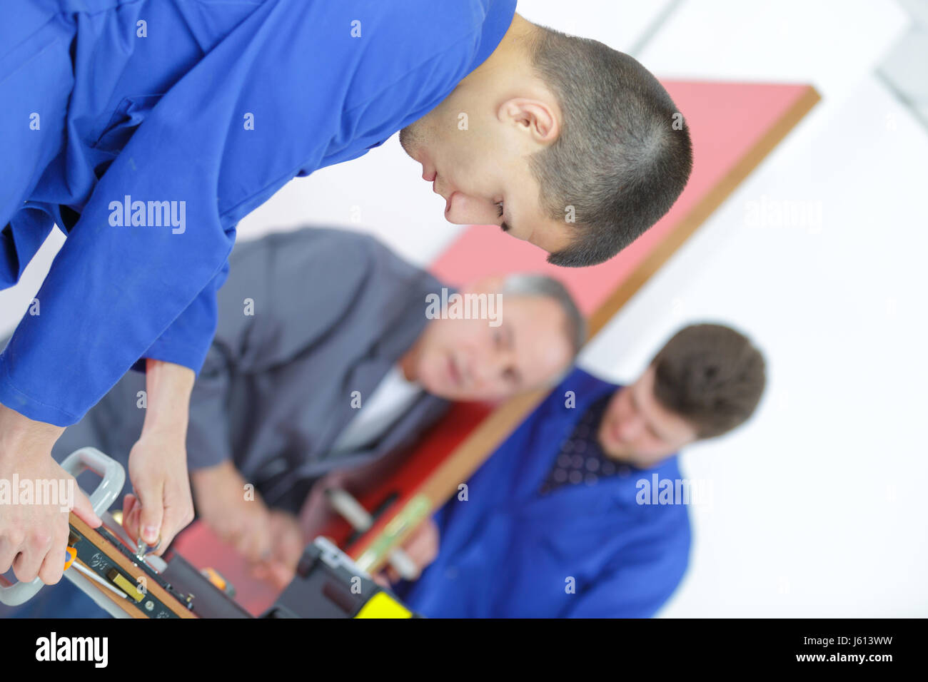 Student tradesmen at work Stock Photo - Alamy