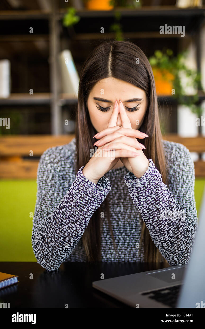Woman thinking working with laptop and planning work Stock Photo - Alamy