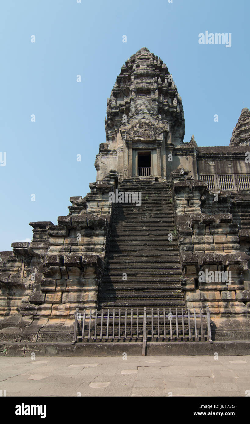 Steep stairs ascent to the spire at the top level of Angkor Wat Stock ...