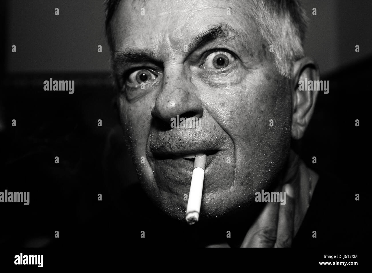 cigarette eyes stare rigid torn open smoker whiff smoke smoking man ...