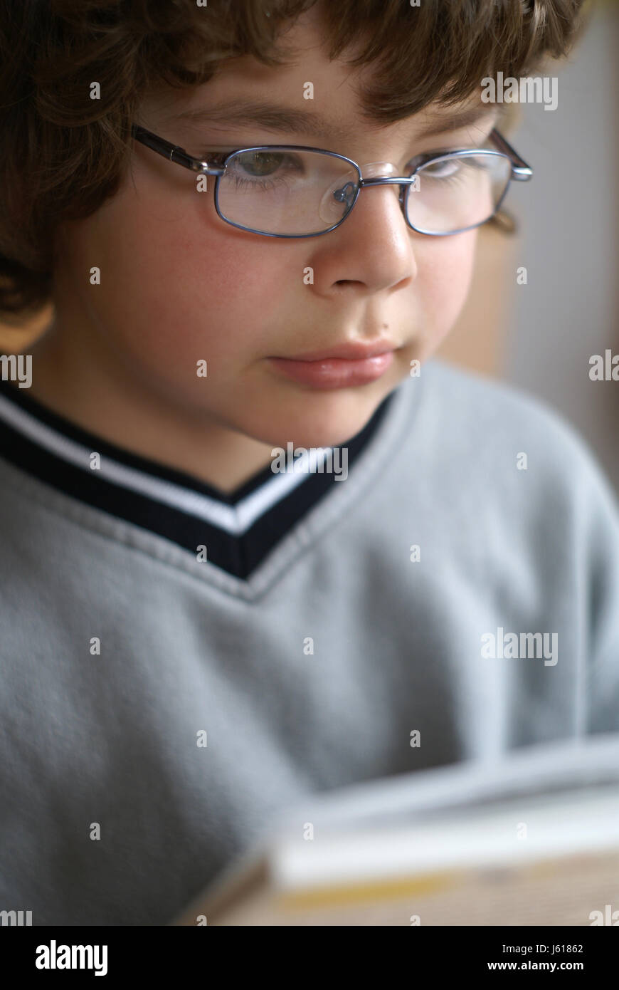 young younger scanning reads book portrait learn schoolchild young ...