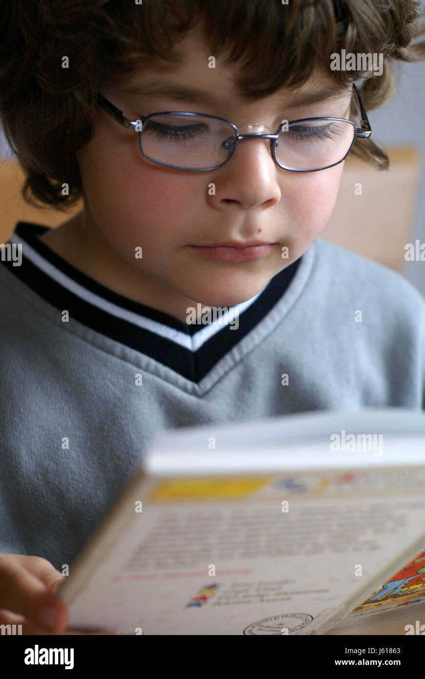 young younger scanning reads book portrait learn schoolchild young ...