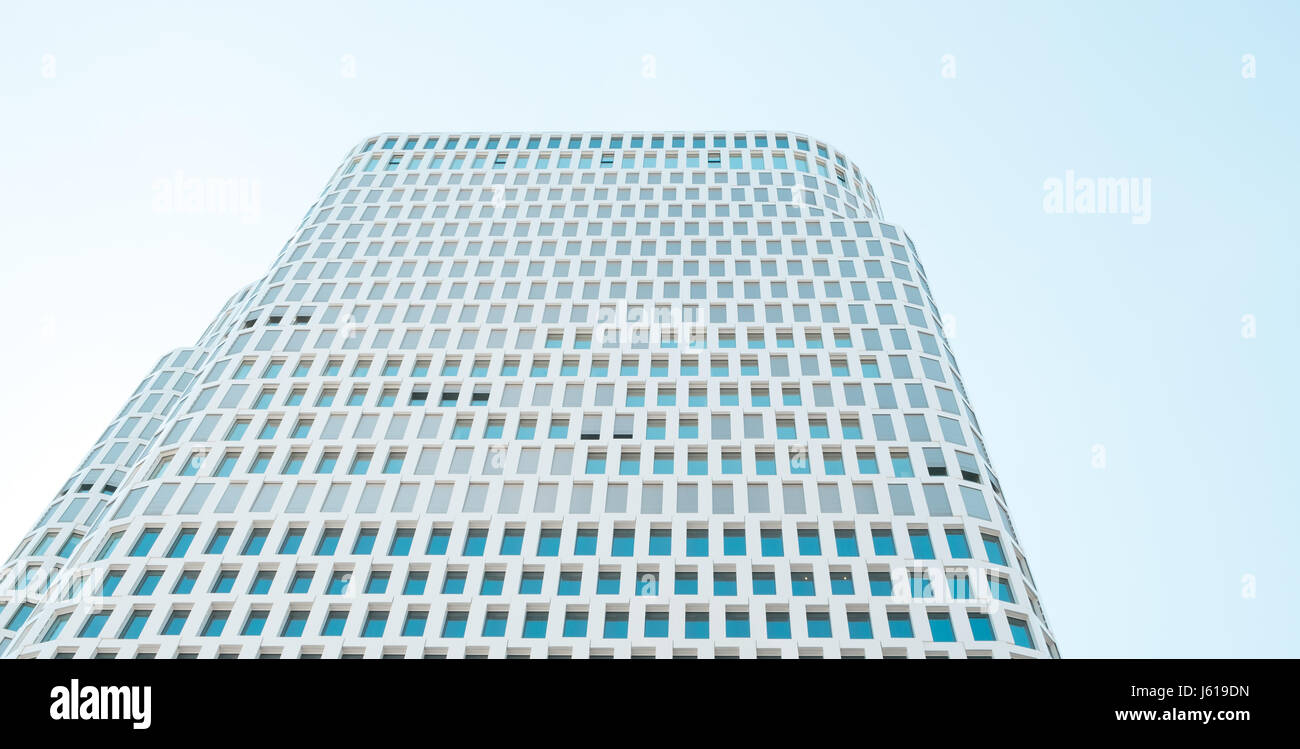looking up on modern white skyscraper facade Stock Photo - Alamy