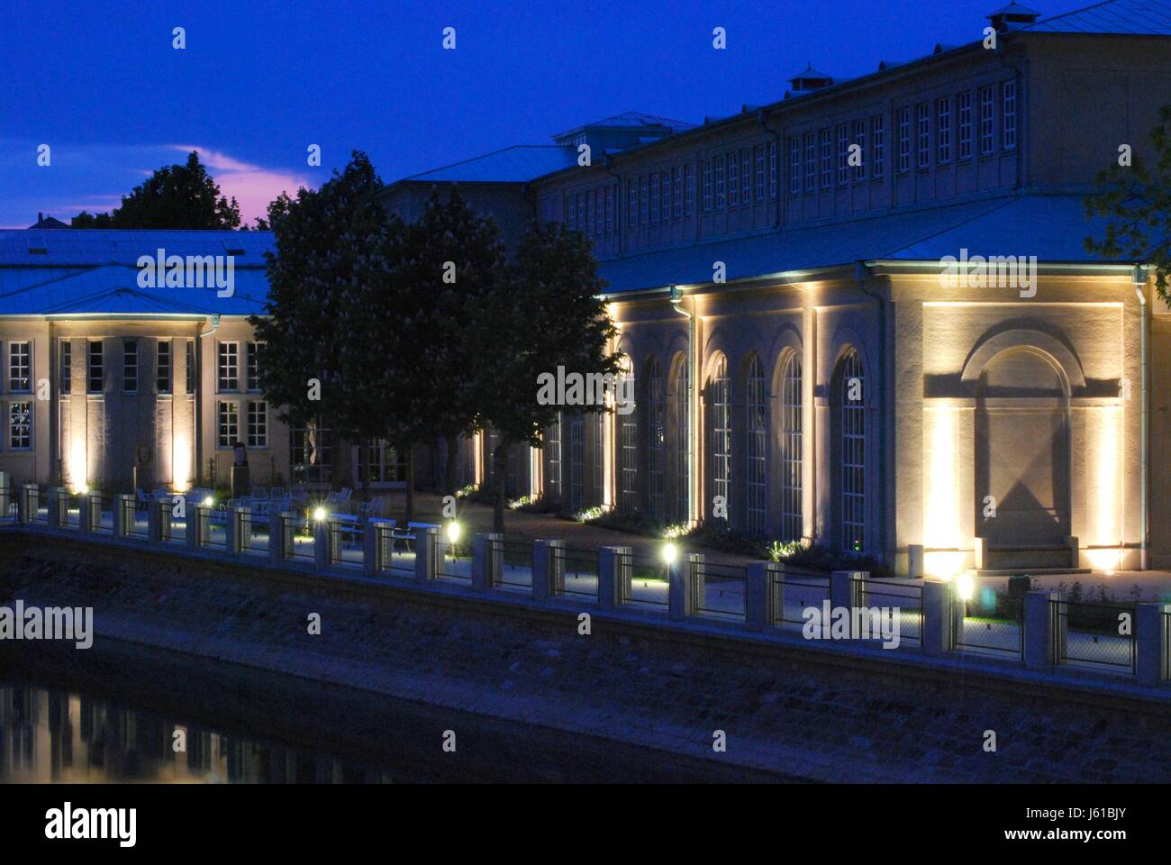 park night nighttime lighted wall river water tree park stone night ...