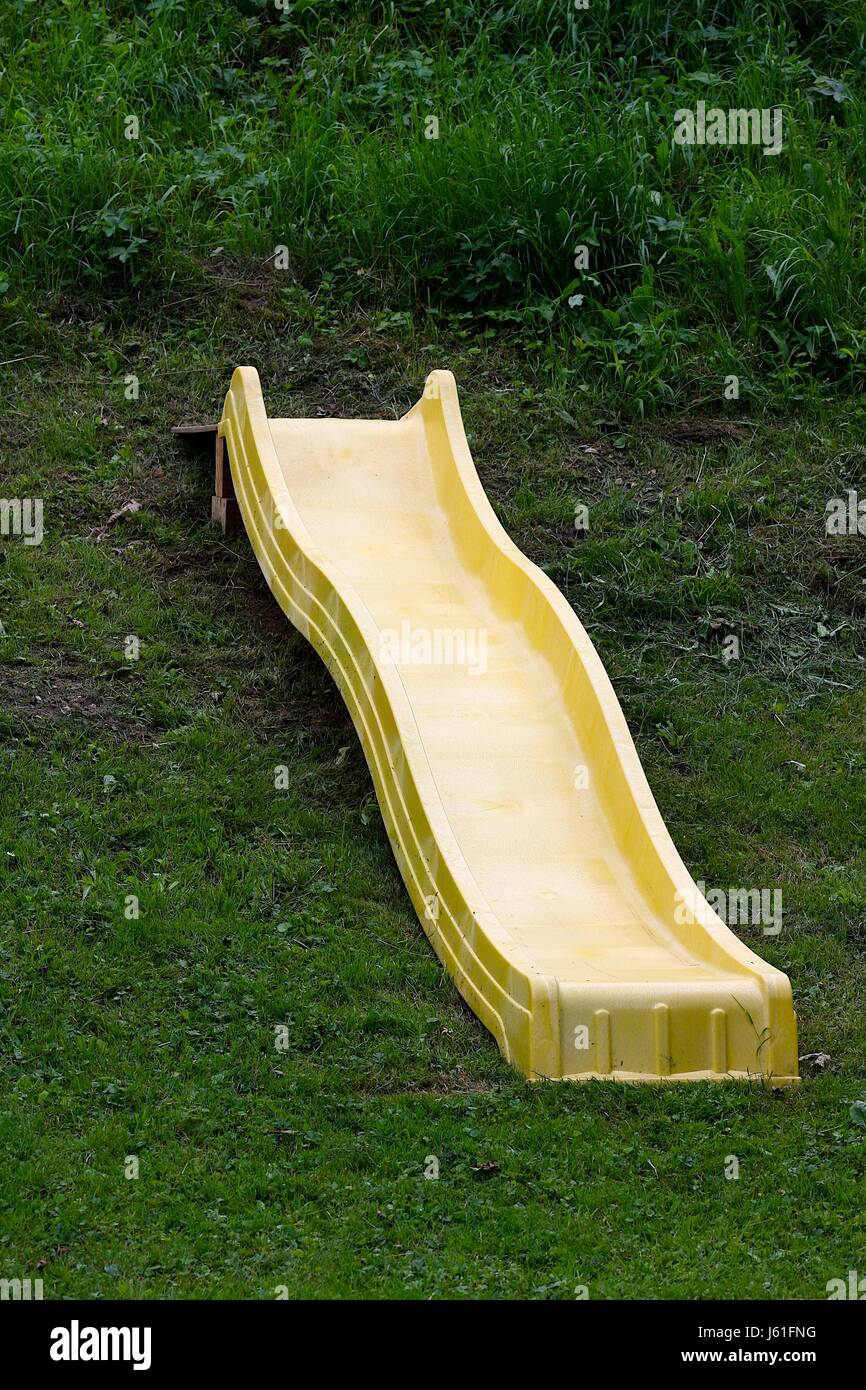 plastic slide on meadow Stock Photo - Alamy