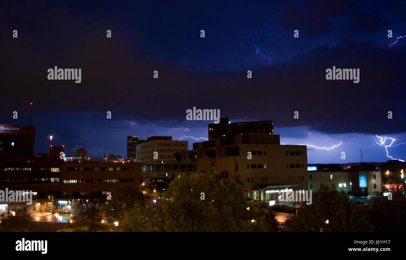 city town night nighttime lights lightning sheet lightning flash ...