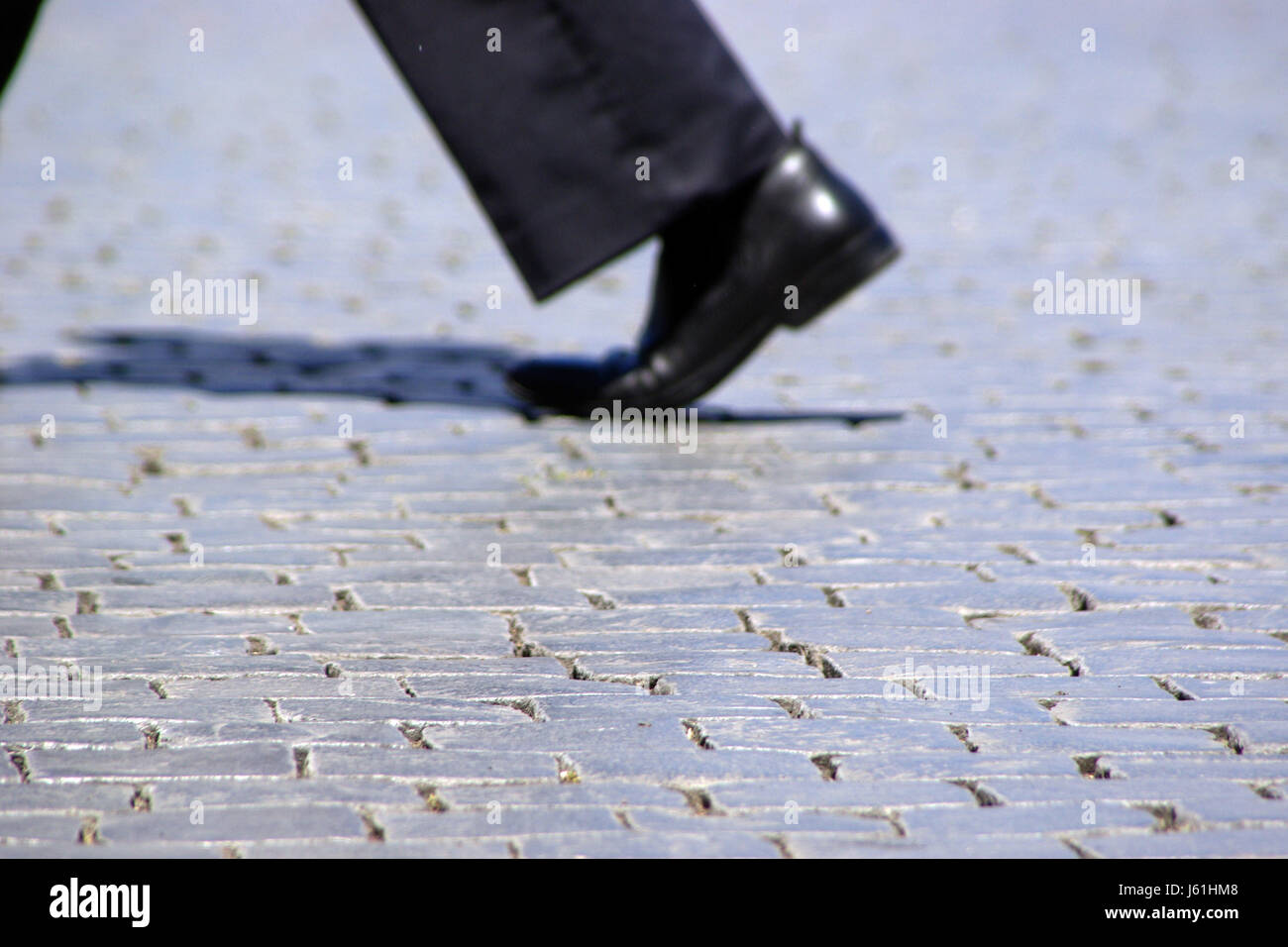 business man businessman bouldering cobblestone hurry leg suit detail ...