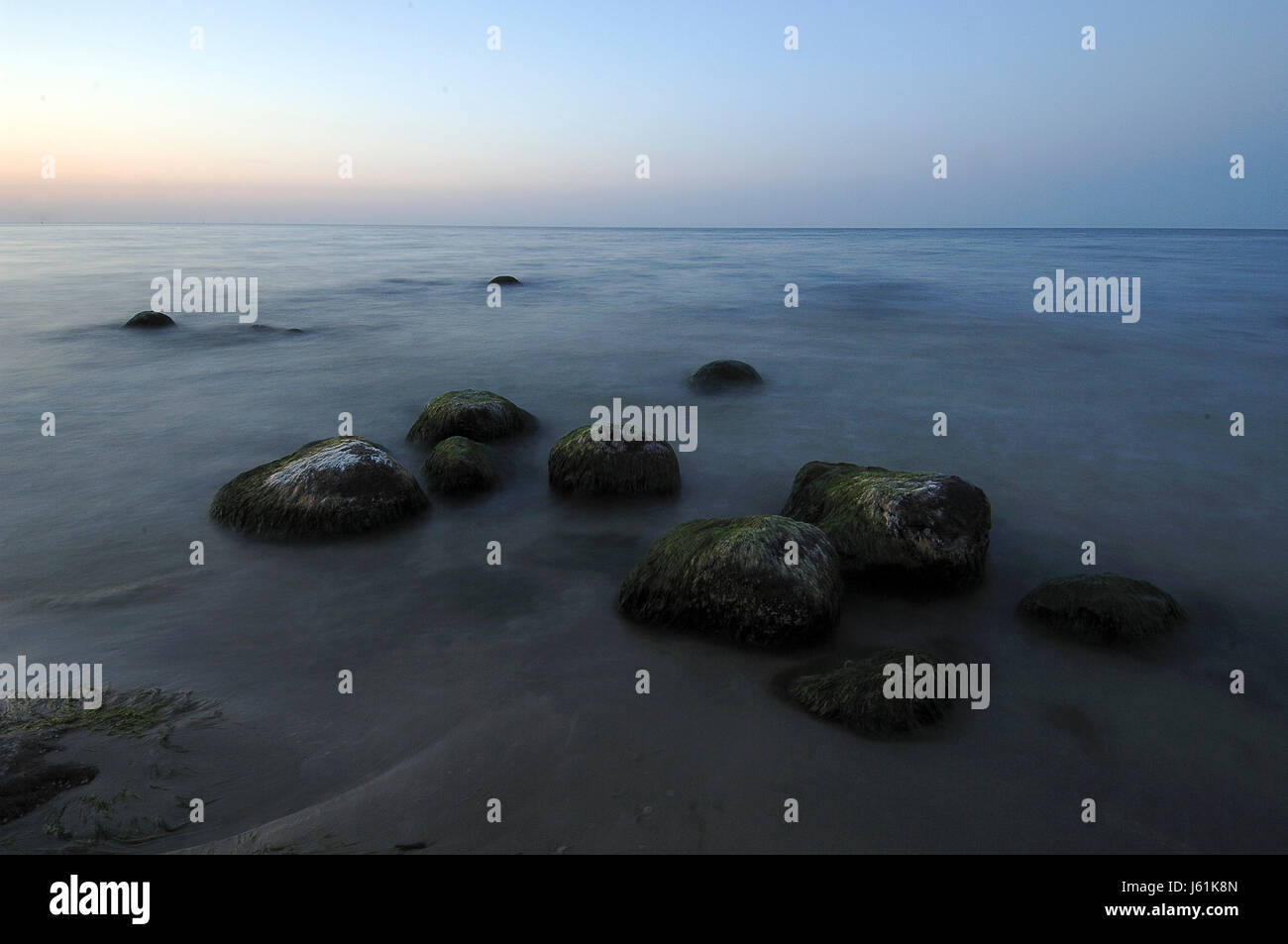 stones in sea Stock Photo - Alamy