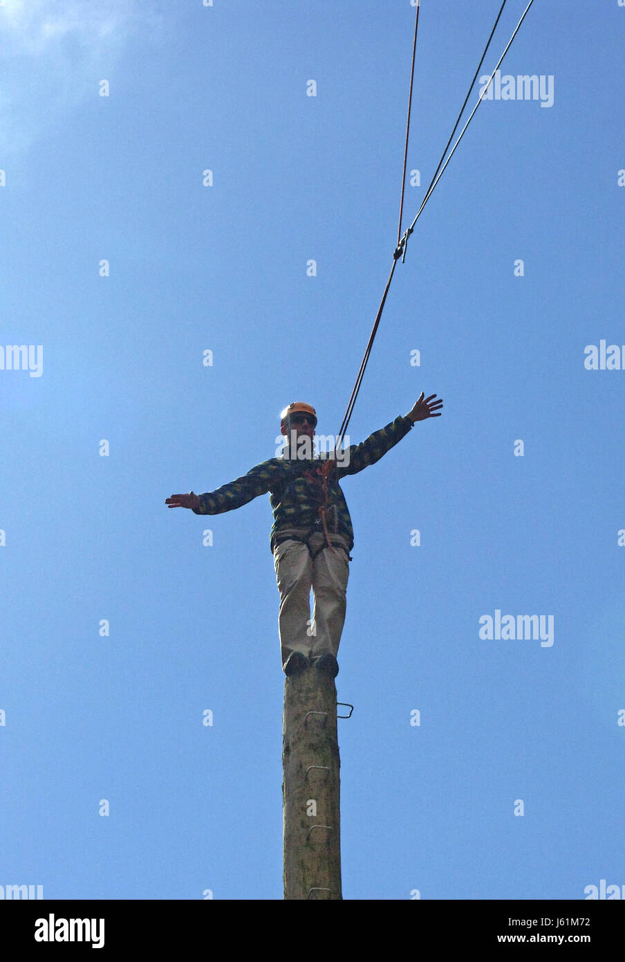 balancing on the pamper pole Stock Photo - Alamy