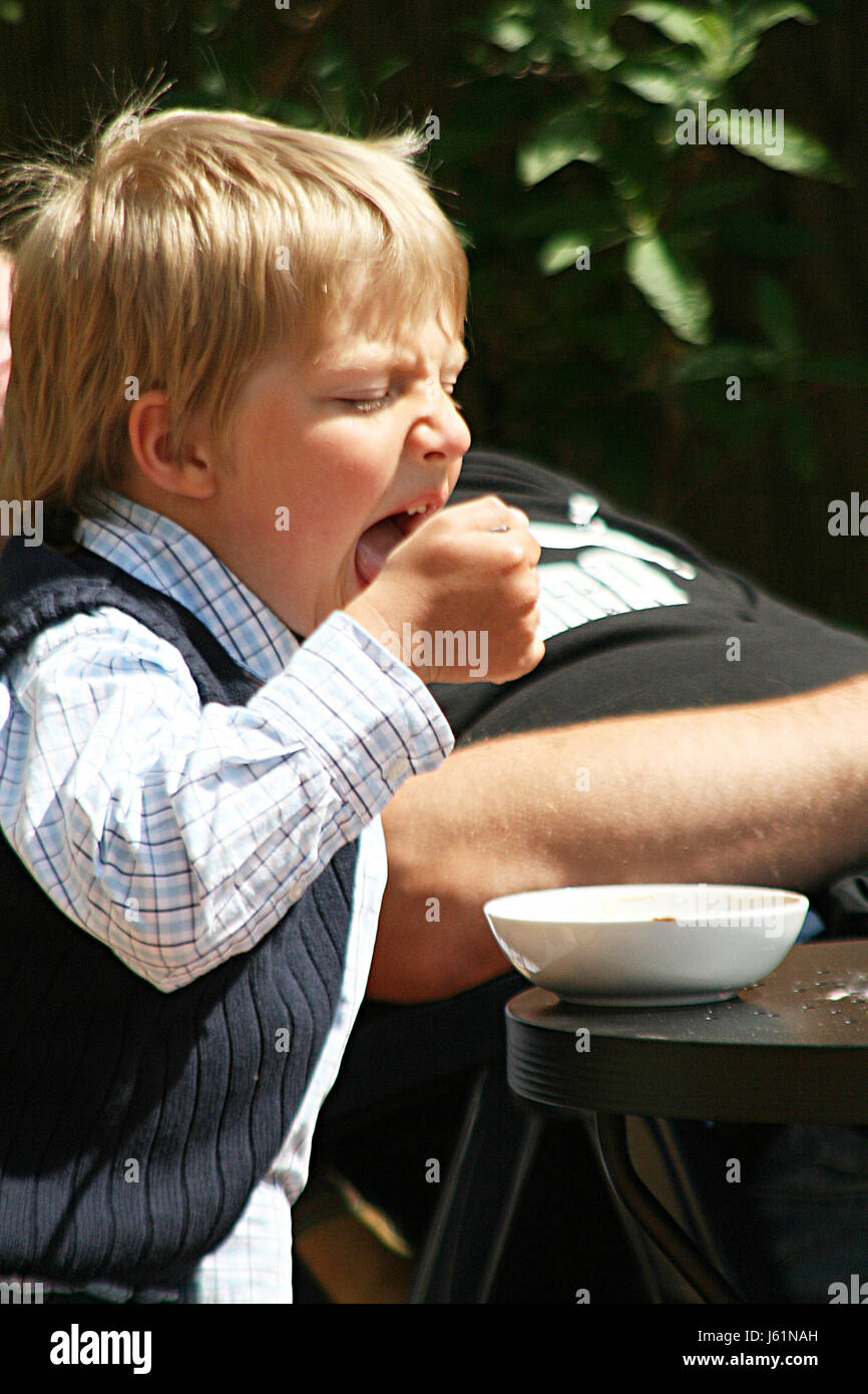 hunger hungry bowl young younger child eating eat eats blond garden ...