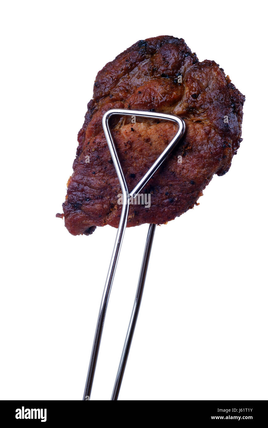 steak grilled pliers tongs isolated portrait format grill barbecue ...