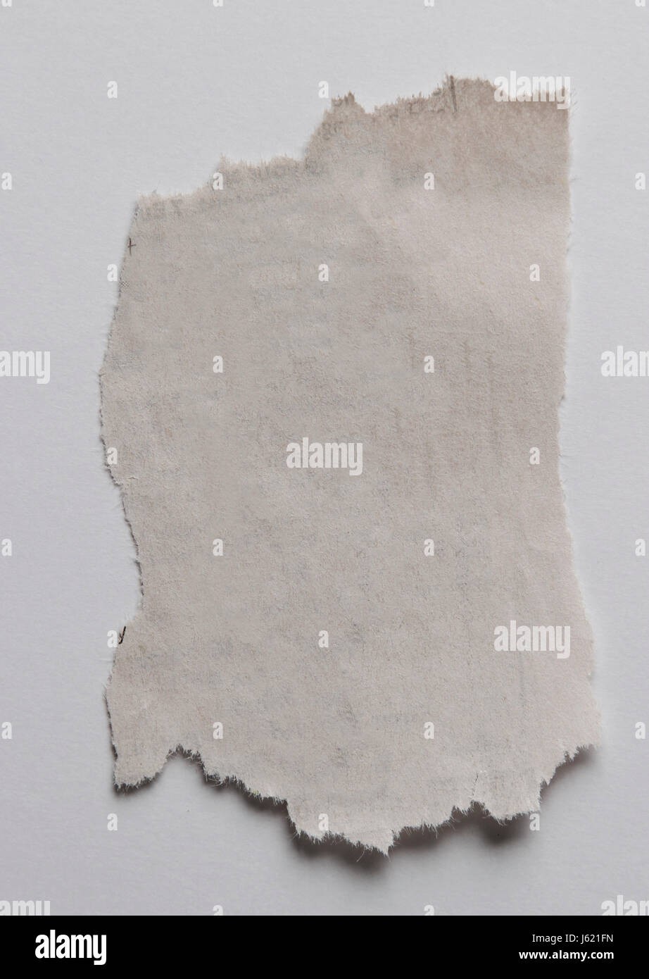 Piece of torn paper on plain background Stock Photo - Alamy