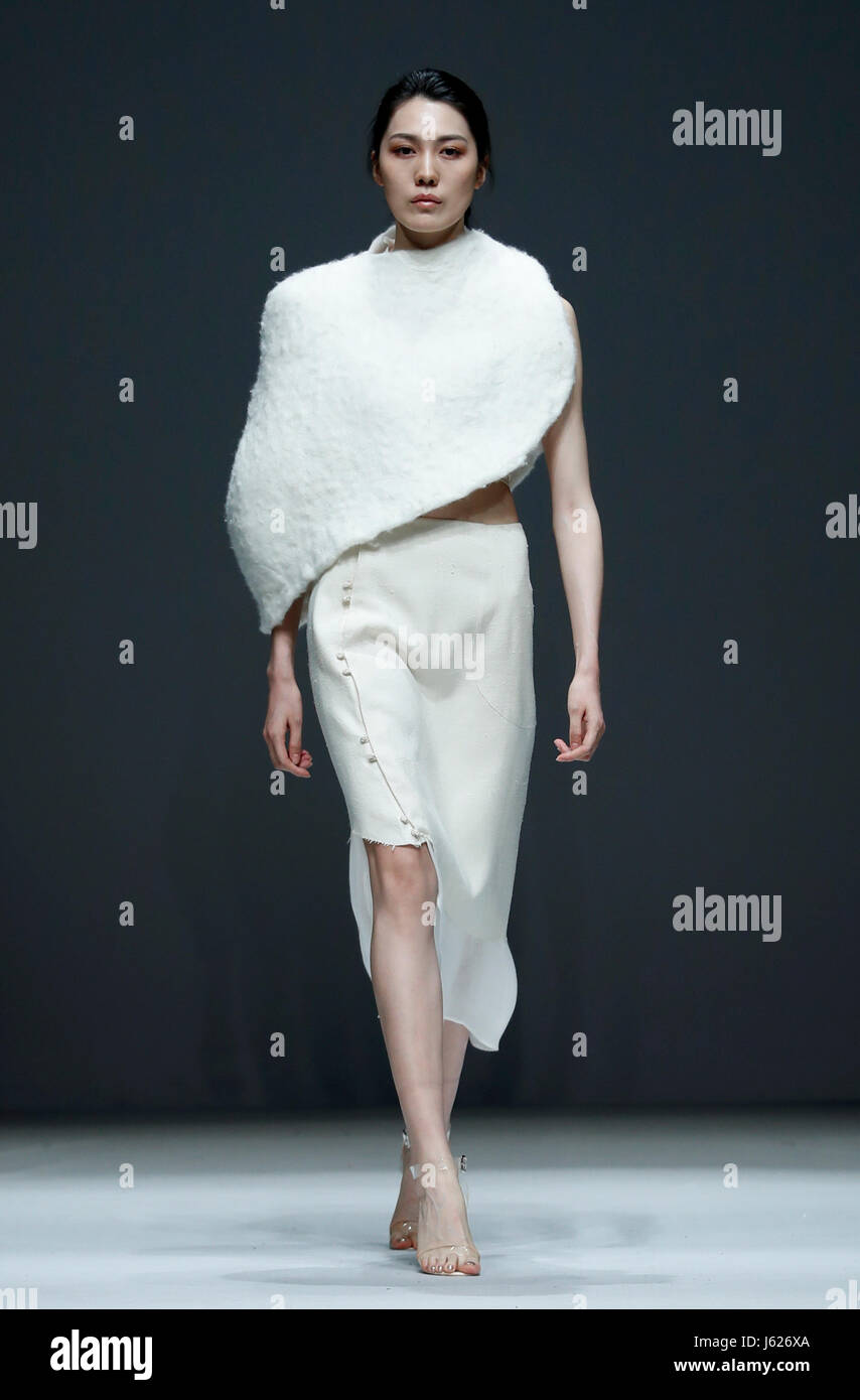 Beijing, China. 18th May, 2017. A model presents a creation designed by ...