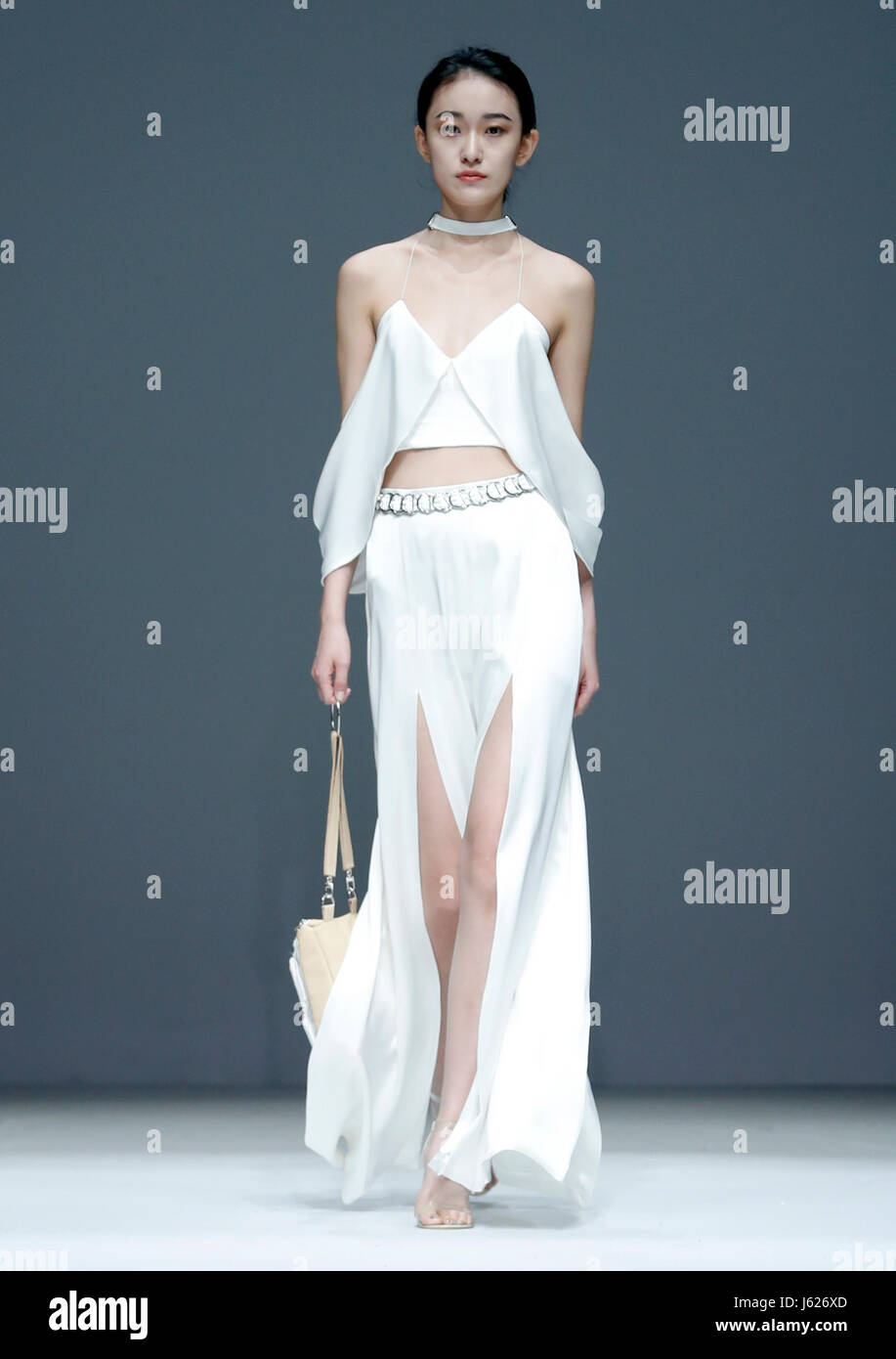 Beijing, China. 18th May, 2017. A model presents a creation designed by ...