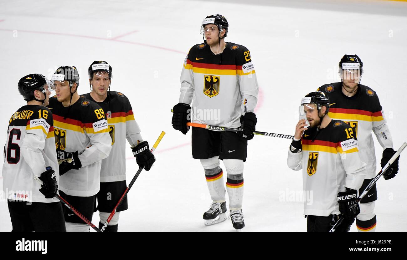 Cologne, Germany. 18th May, 2017. German players stand on the ice after ...