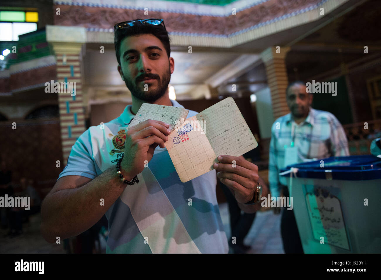 Tehran, Iran. 19th May, 2017. A voter displays the stamp on his ...