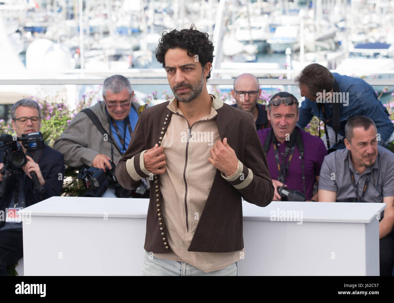 Cannes, France. 19th May, 2017. Actor Ghanem Zrelli poses for a ...