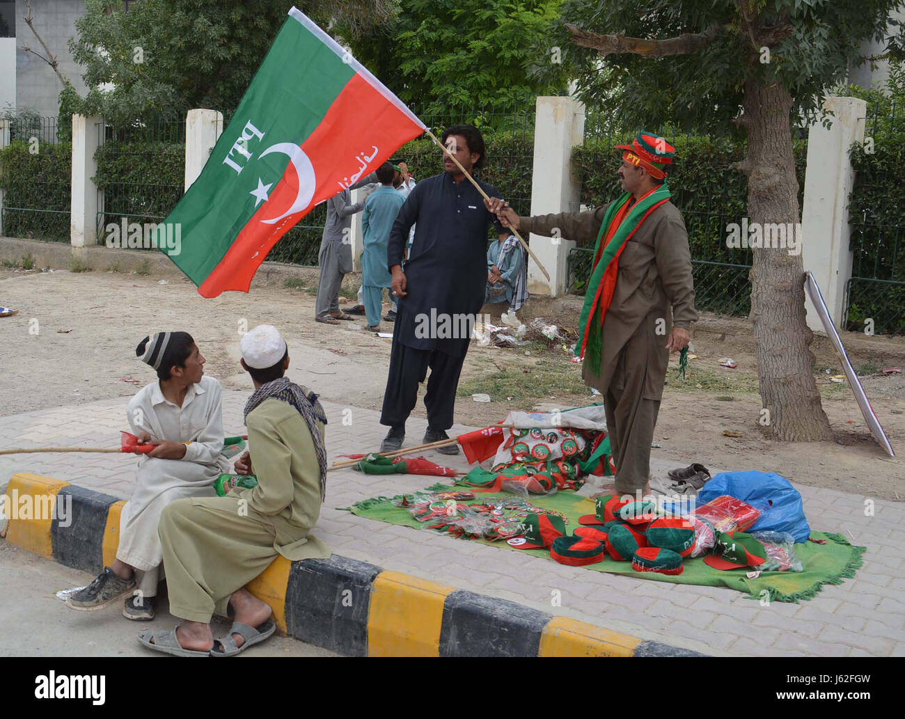 PTI flags and souvenirs are being selling outside Ayyub Stadium on the ...
