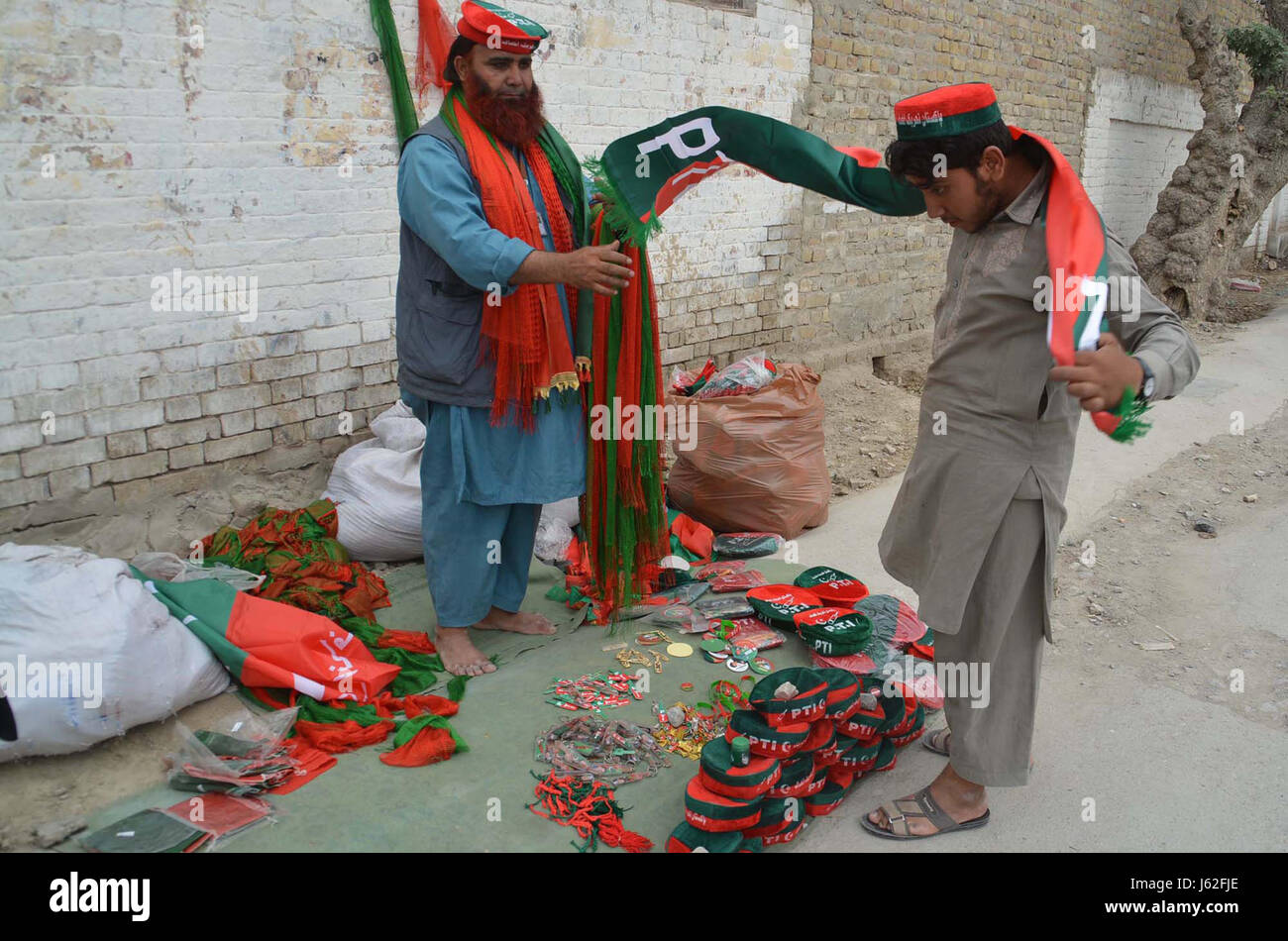 PTI flags and souvenirs are being selling outside Ayyub Stadium on the ...