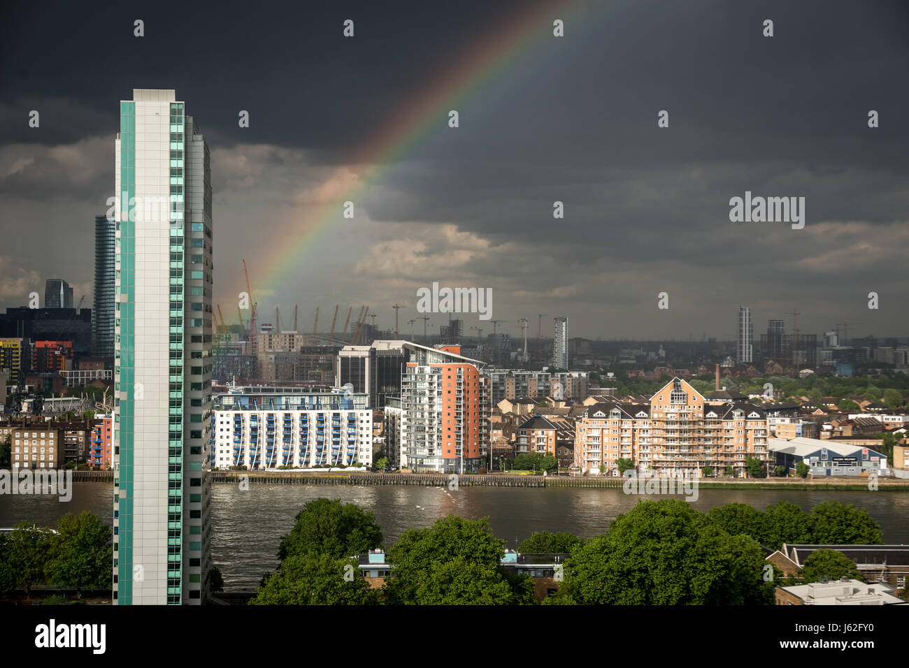 London, UK. 19th May, 2017. UK Weather: Colourful rainbow breaks during ...