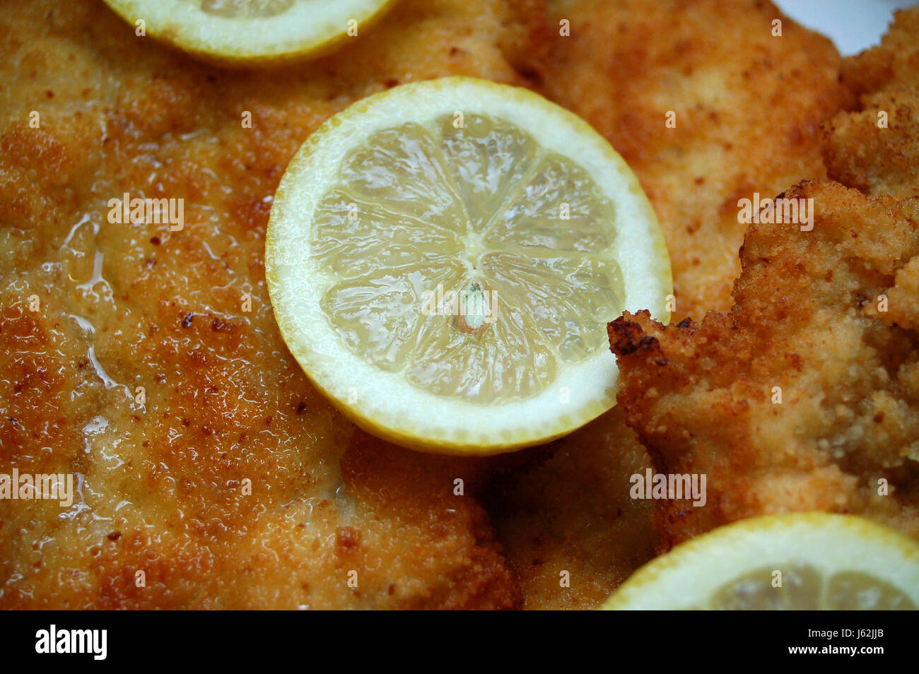 golden viennese schnitzel bake veal lemon slice austrians small tiny ...