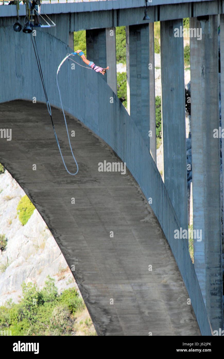 woman bridge spring bouncing bounces hop skipping frisks jumping jump ...
