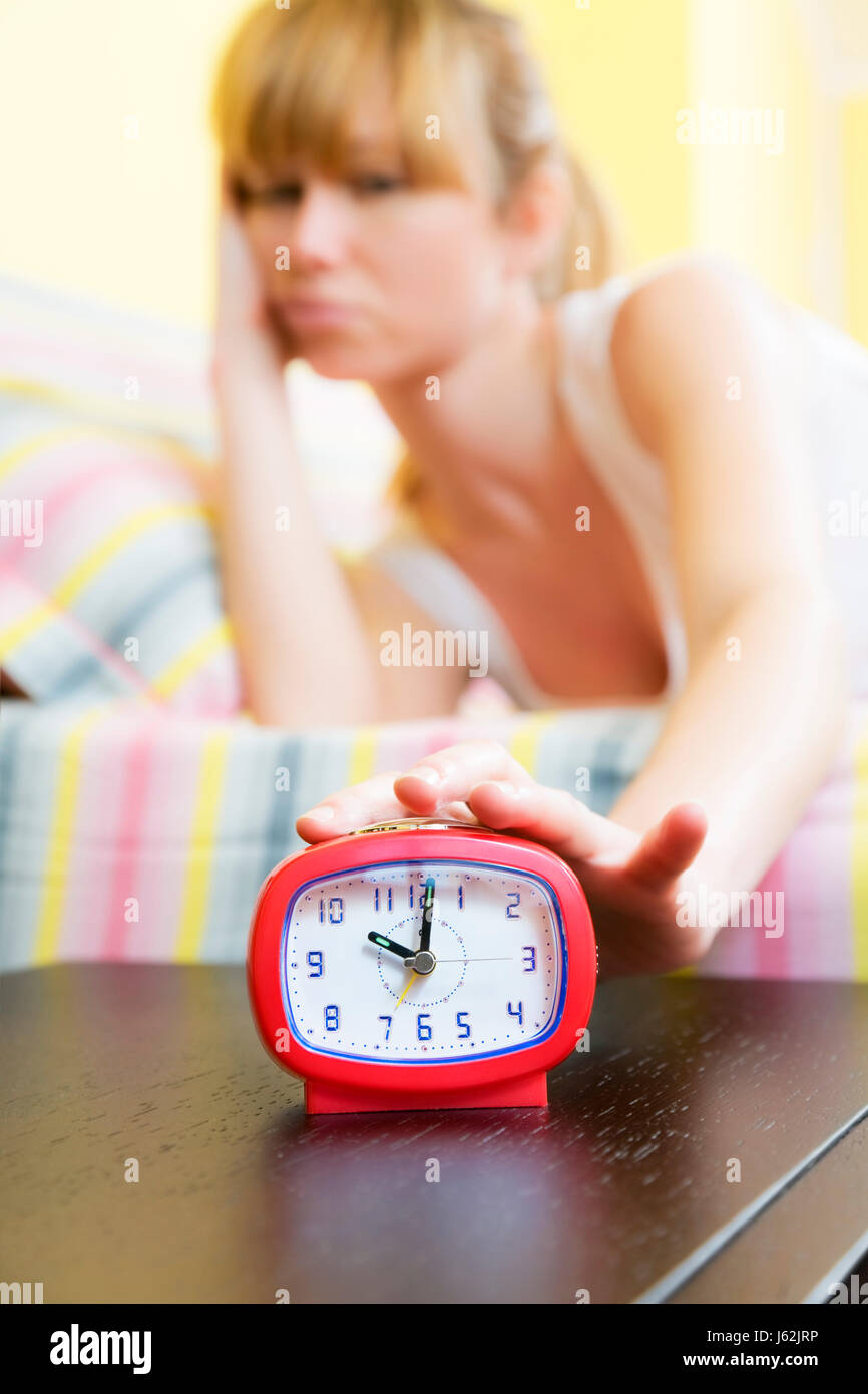 woman bed clock sleep sleeping waking alarm woman humans human beings ...