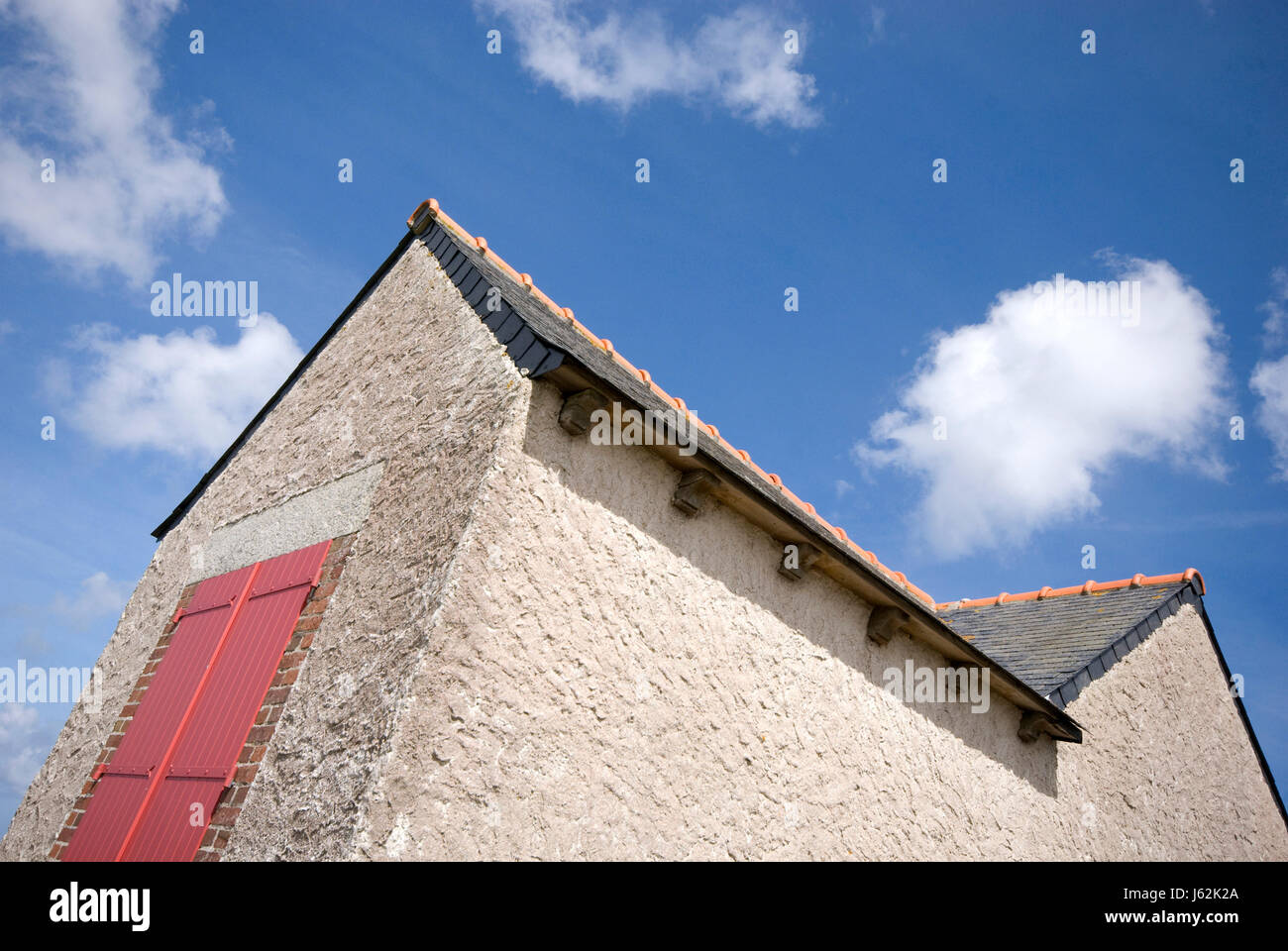 house with red gate Stock Photo - Alamy