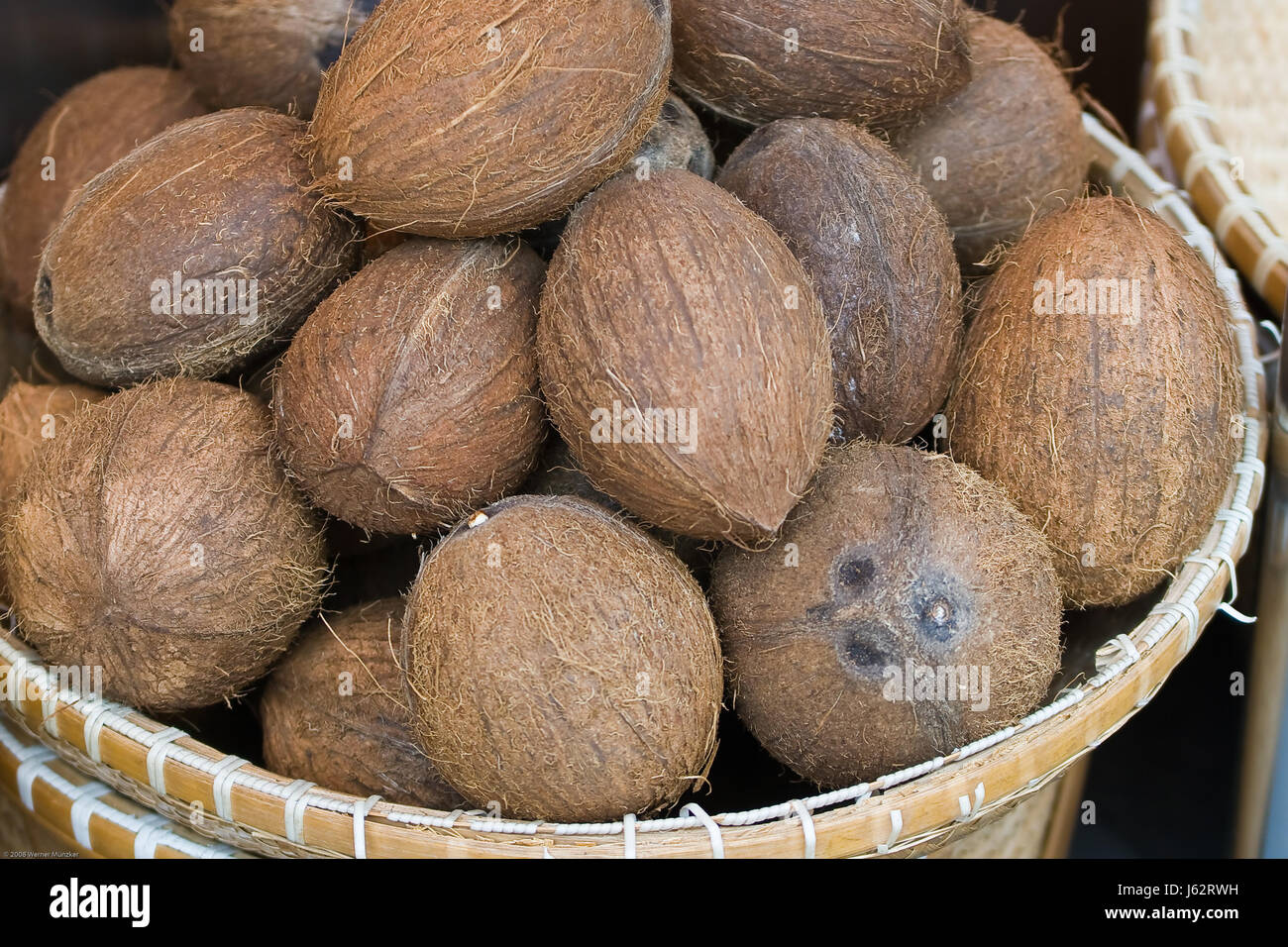 coconut in basket Stock Photo - Alamy